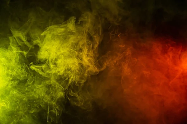 Yellow-blue smoke in neon light on black background. — Stock Photo ...