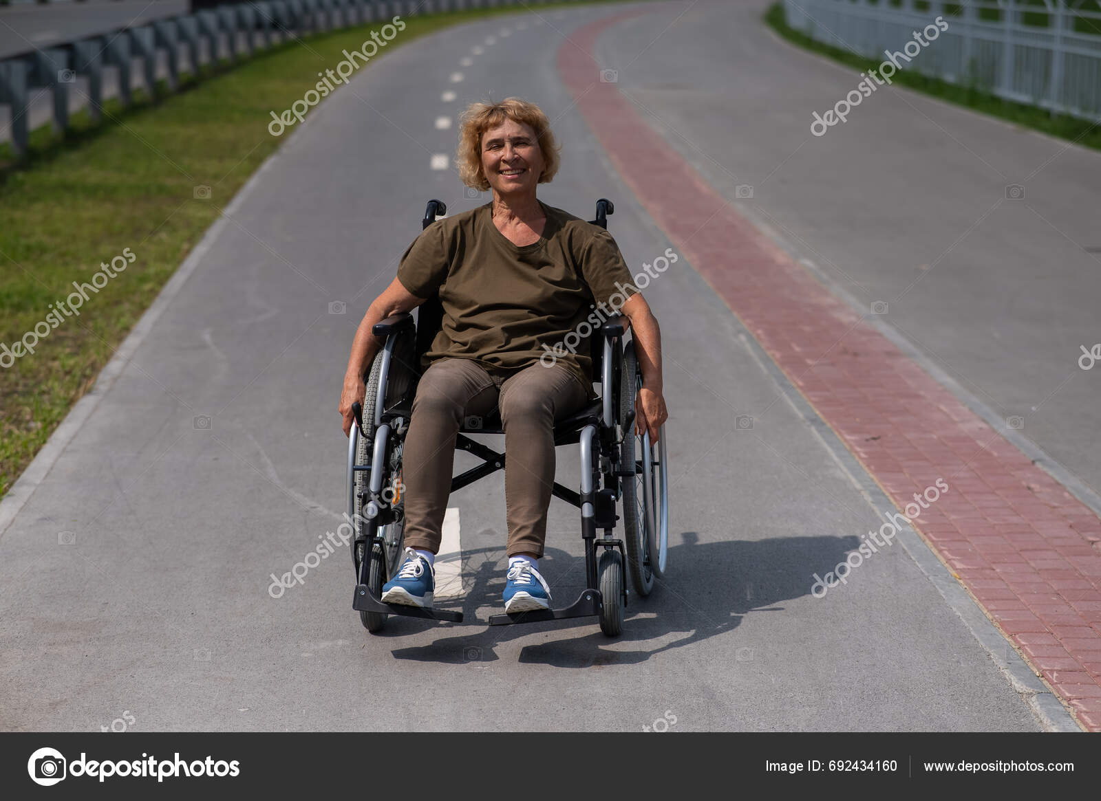 Happy Elderly Woman Wheelchair Rides Bike Path — Stock Photo © inside ...
