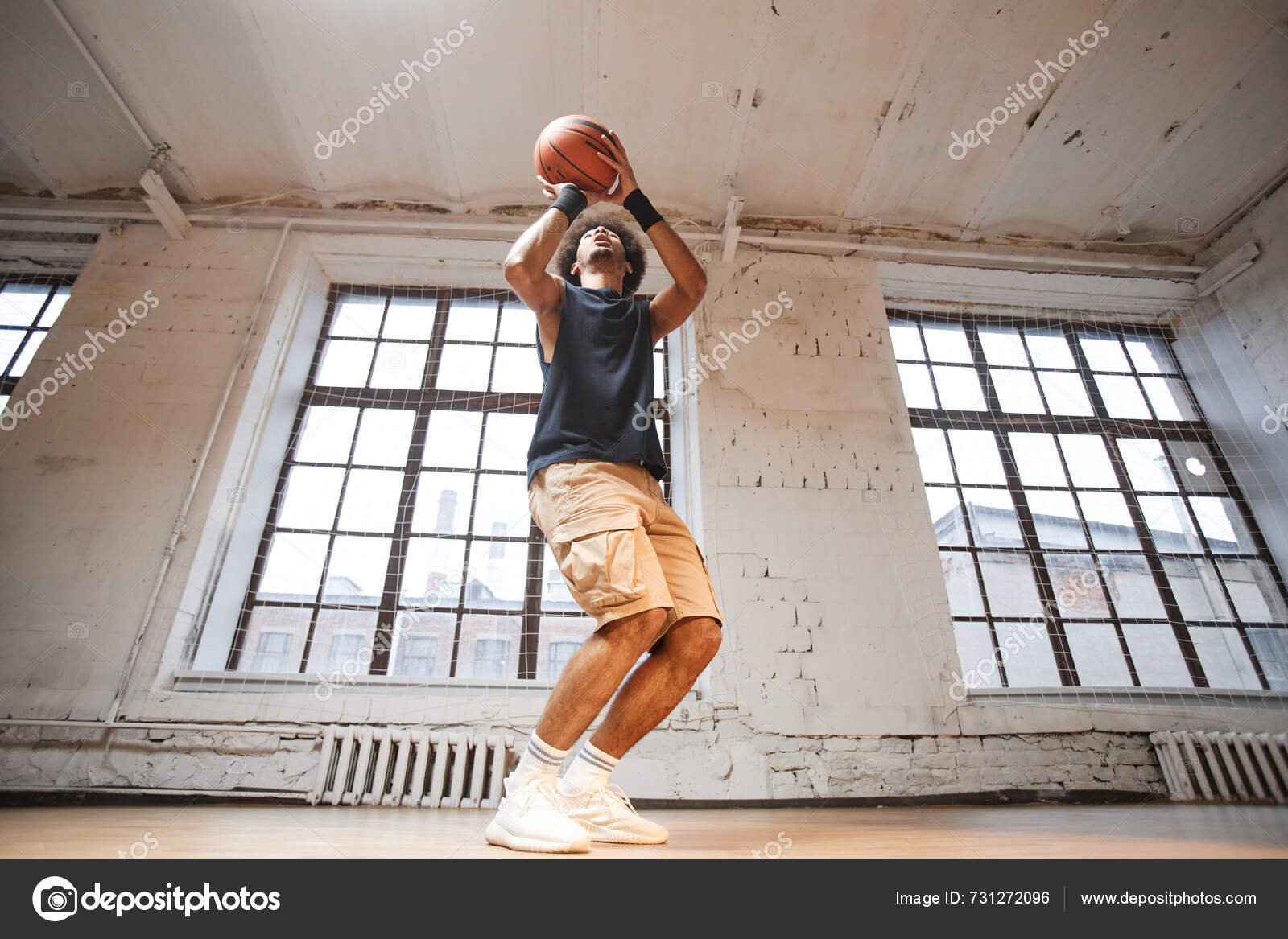 Low Angle Action Shot Pro African American Basketball Player Throwing ...