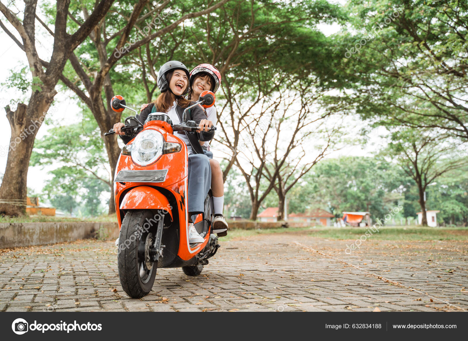 Two Happy Friends Chatting Helmets While Riding Motorcycle Outdoor ...