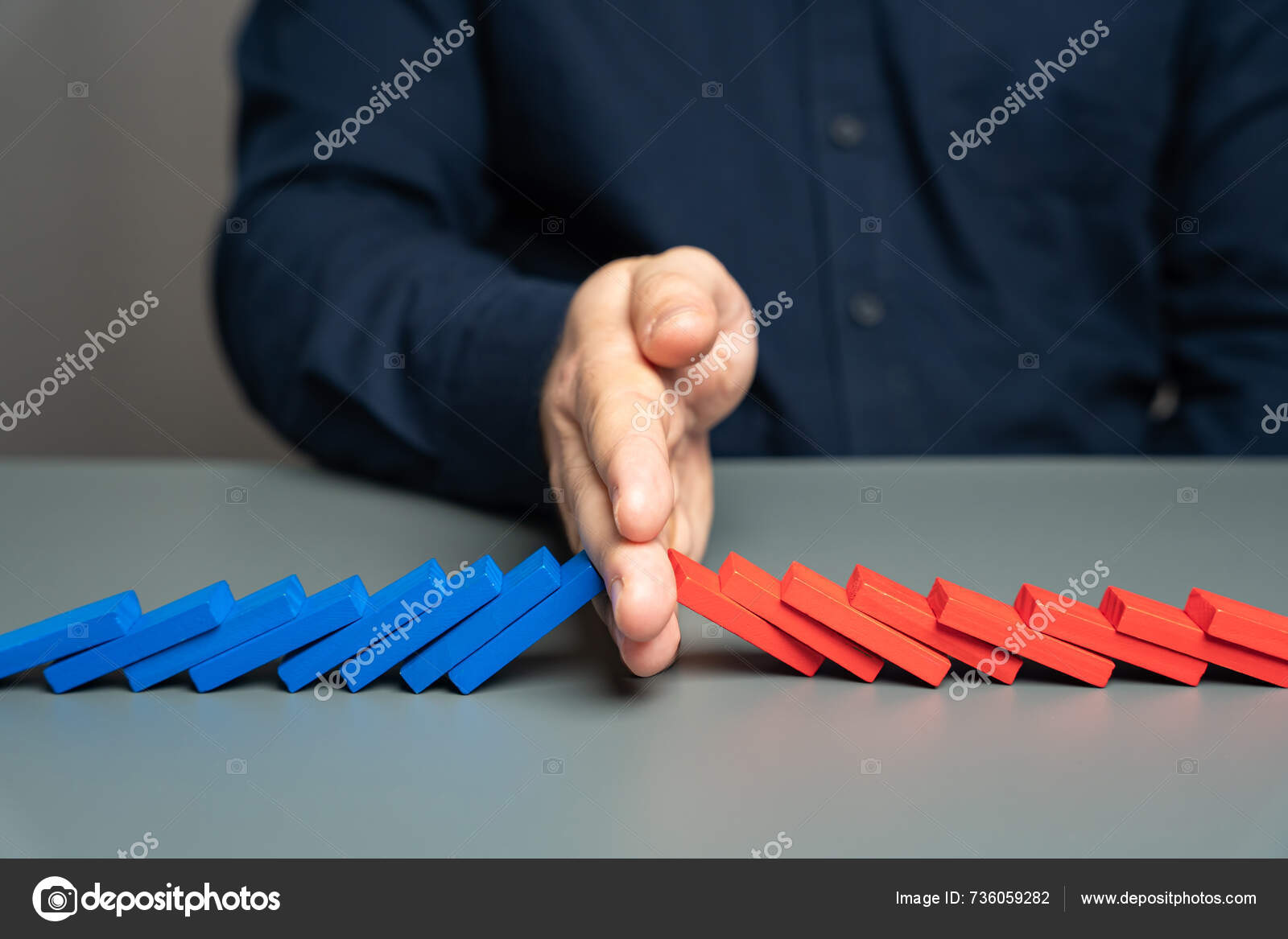 Man Stops Two Domino Chains Colliding Concept Stopping Conflict ...
