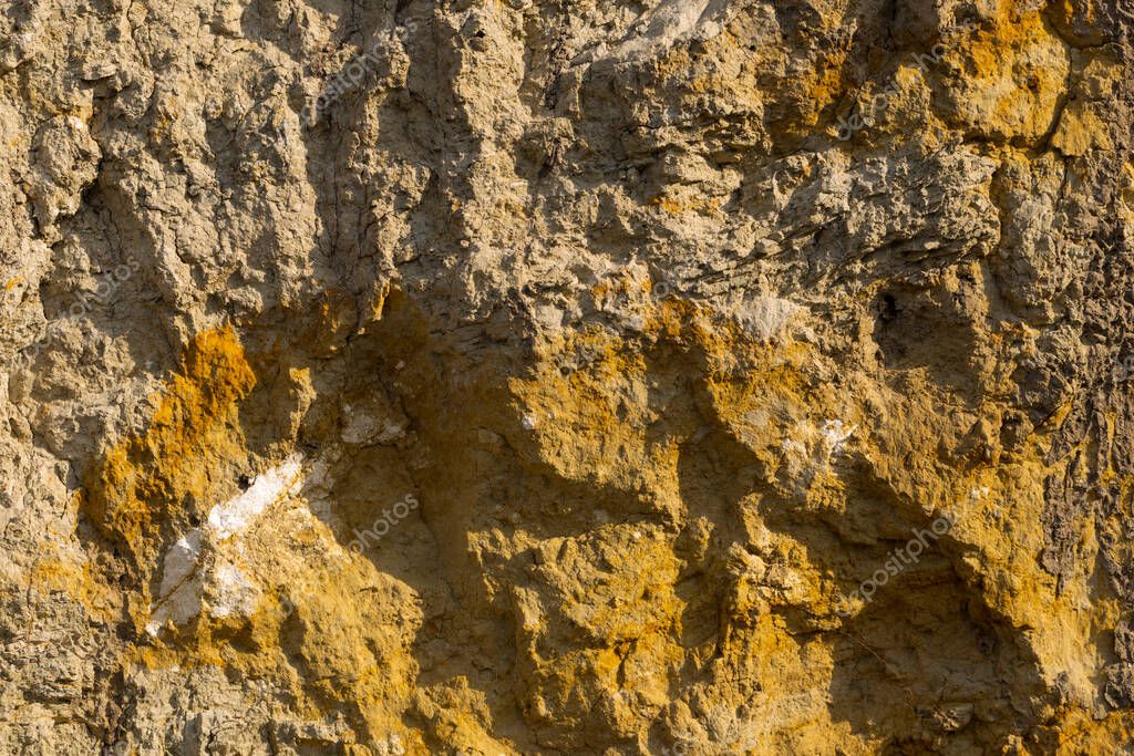 Sedimentary rocks with a high content of iron oxide. Red soil, loam ...