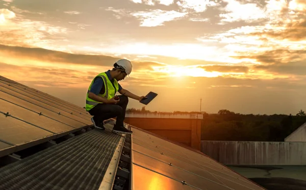 Engineer working setup Solar panel at the roof top. Engineer or worker ...