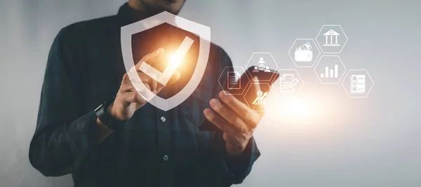 Businessman using mobile smartphone to buy insurance online for car ...