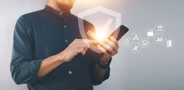 Businessman using mobile smartphone to buy insurance online for car ...