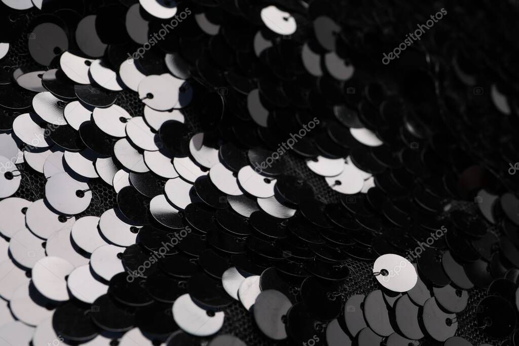 Hermosa tela de lentejuelas negras como fondo, primer plano 2024