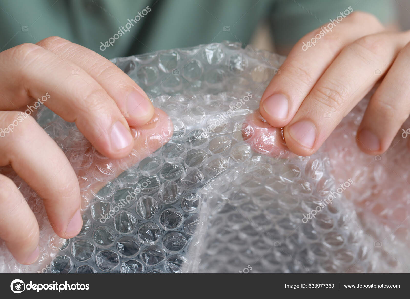 Senior Man Popping original Bubble Wrap Home