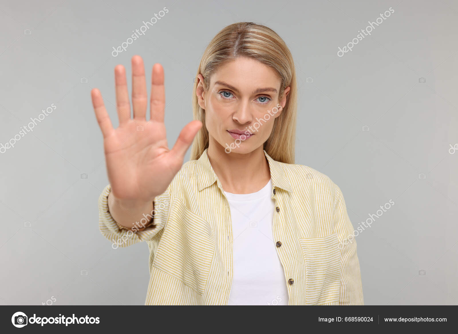 Woman Showing Stop Gesture Grey Background Stock Photo by ©NewAfrica ...