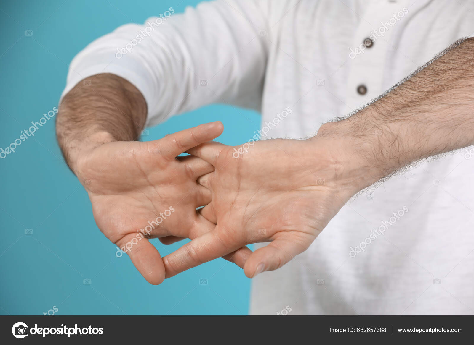 Man Cracking His Knuckles Light Blue Background Closeup Bad Habit ...