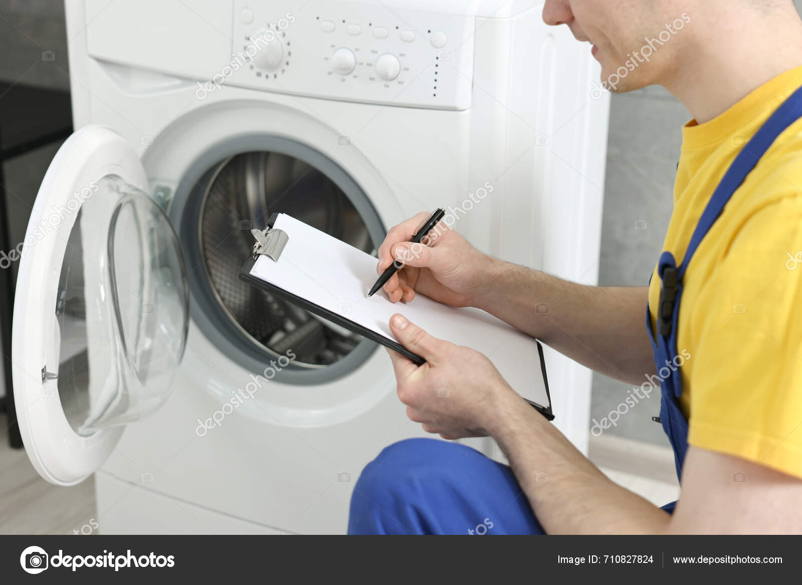Plumber Writing Results Examining Washing Machine Bathroom Closeup ...