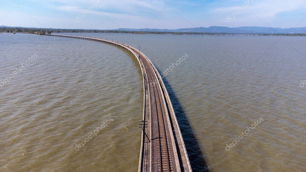 Aerial view of an amazing travel train parked on a floating railway ...