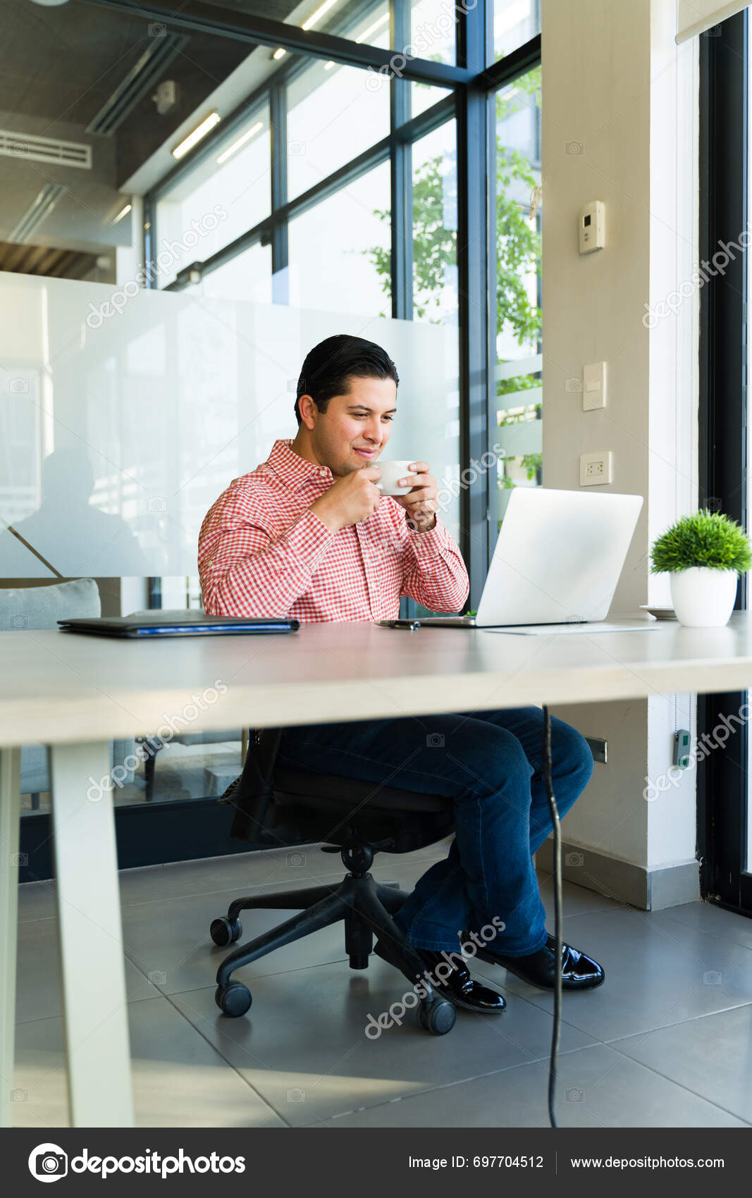 Good Looking Office Worker Enjoying Cup Coffee While Reading His ...