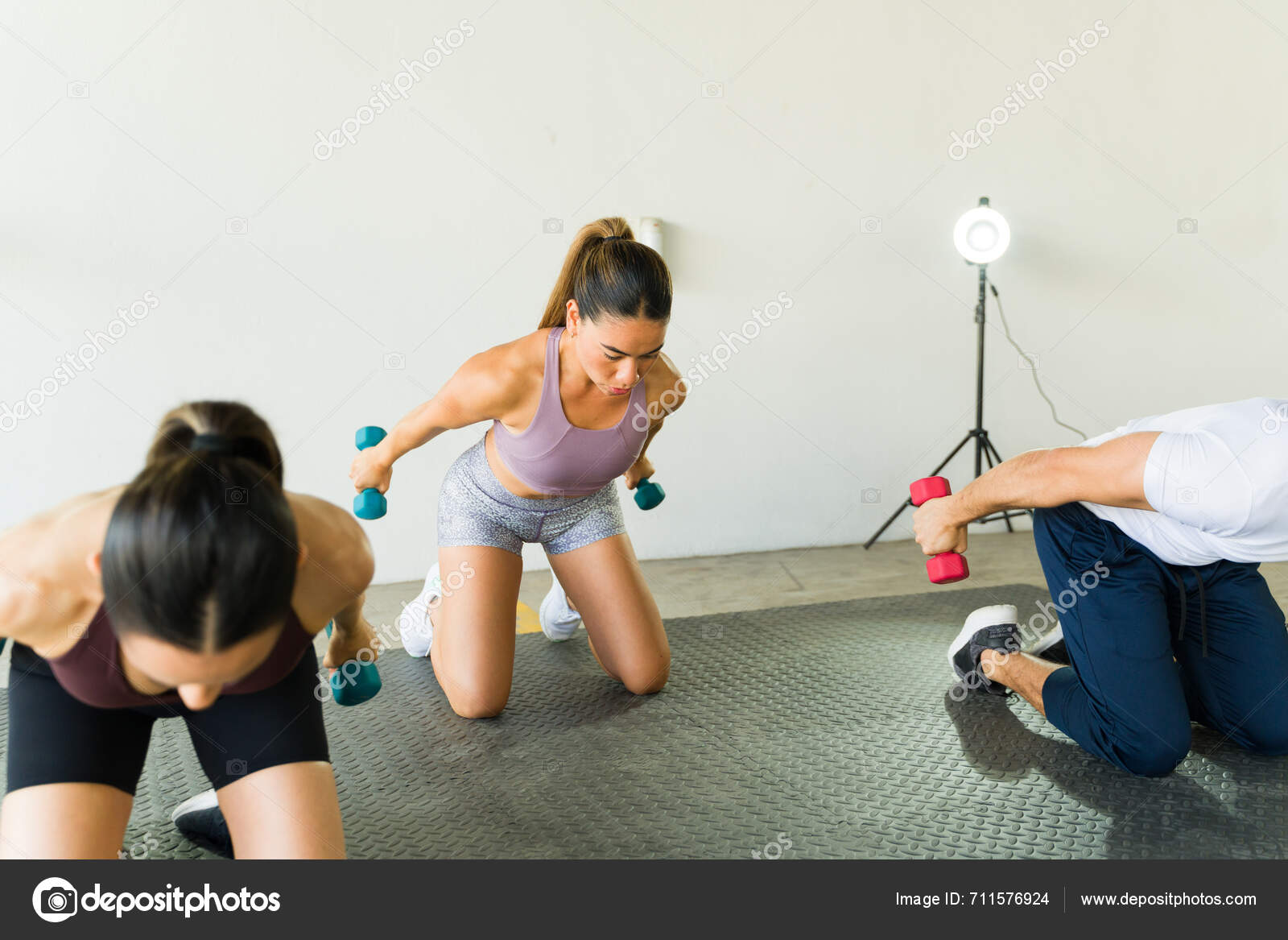 Dynamic Exercise Routine Fitness Class Participants Lifting Weights ...