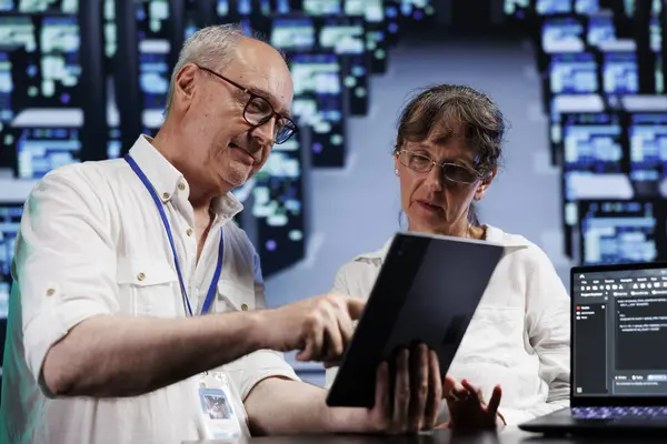 Cloud computing business executives running analysis on supercomputers ...