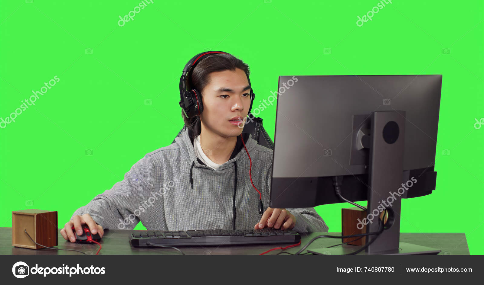 Young Player Sitting Computer Desk Playing Online Video Games Friends ...