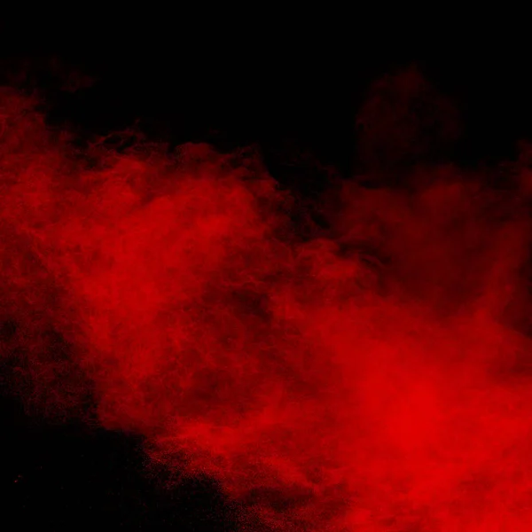 Red color powder explosion on black background.Freeze motion of red ...