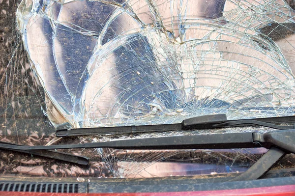 Detail of damage to windscreen of car shattered by vandalism - Stock ...
