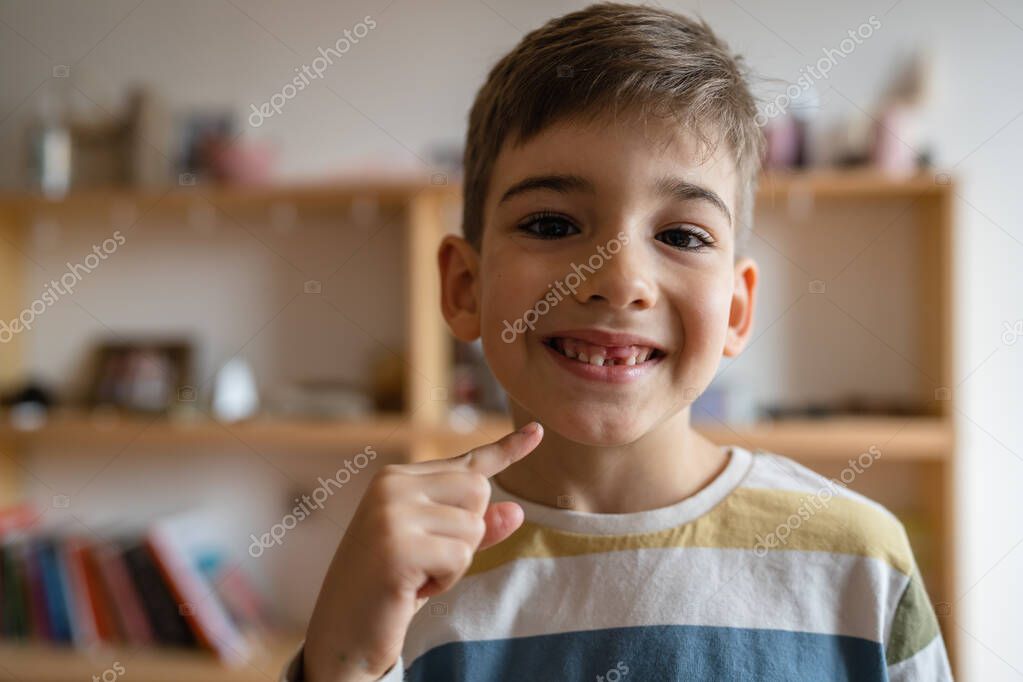 one caucasian boy child at home with Deciduous primary milk teeth lost tooth fallen out dropped ...
