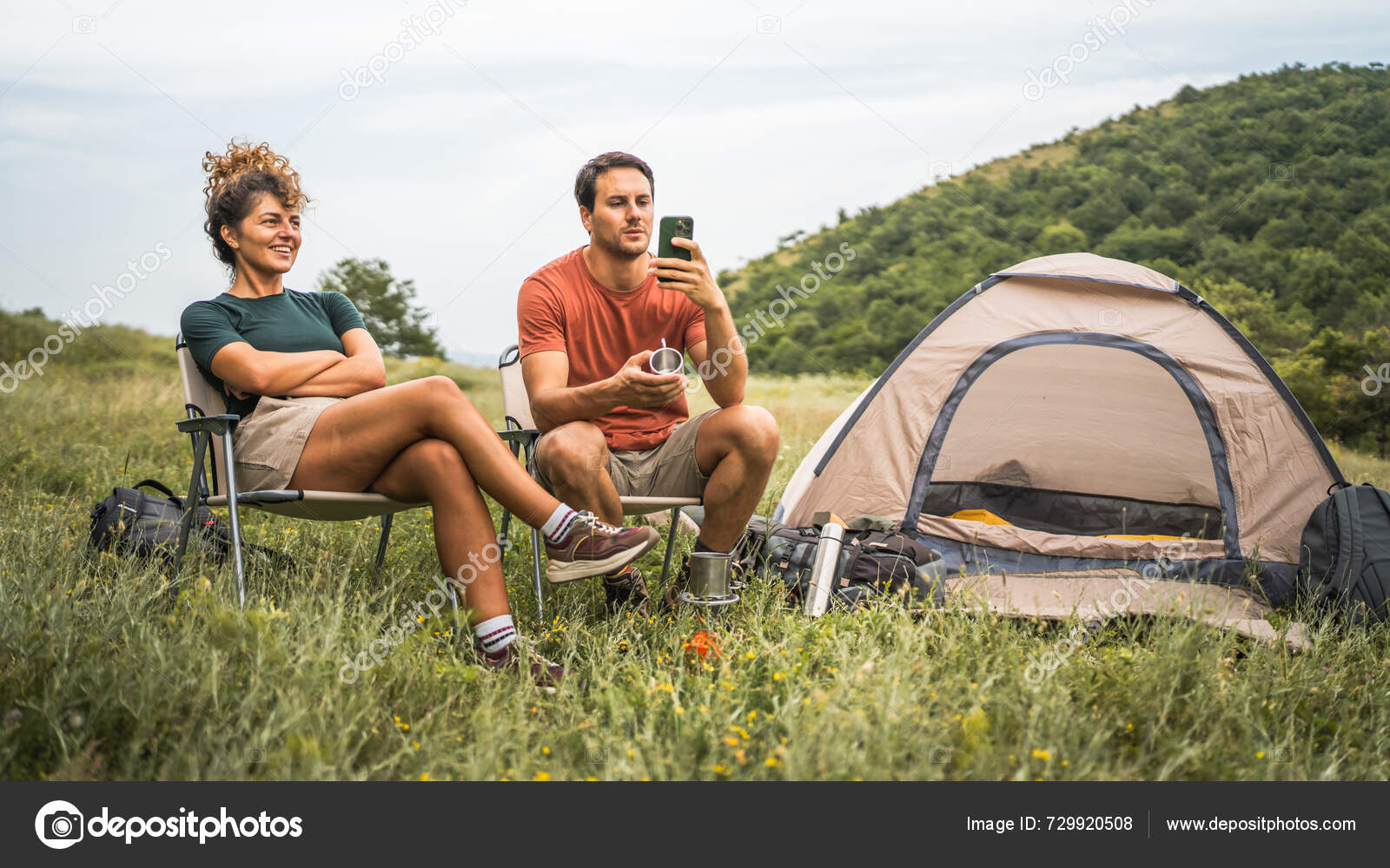 Man Use Mobile Phone While Camp His Girlfriend — Stock Photo © Miljan ...
