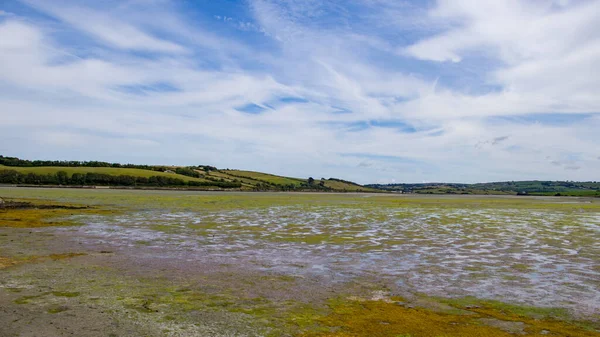 Vast tidal plains in the Ireland on a summer day. Irish landscape. A ...