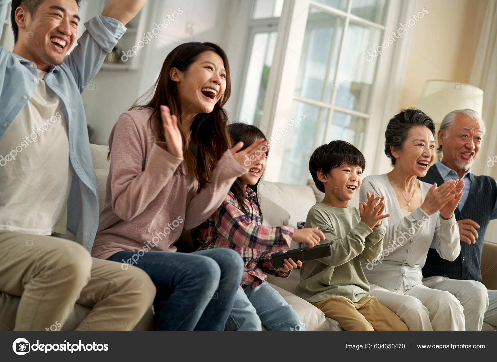 Multi Generational Asian Family Sitting Couch Living Room Home Watching ...