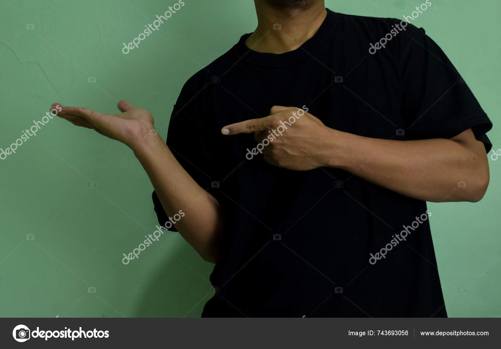 Young Man Showing Direction Hand — Stock Photo © olanstock #743693056