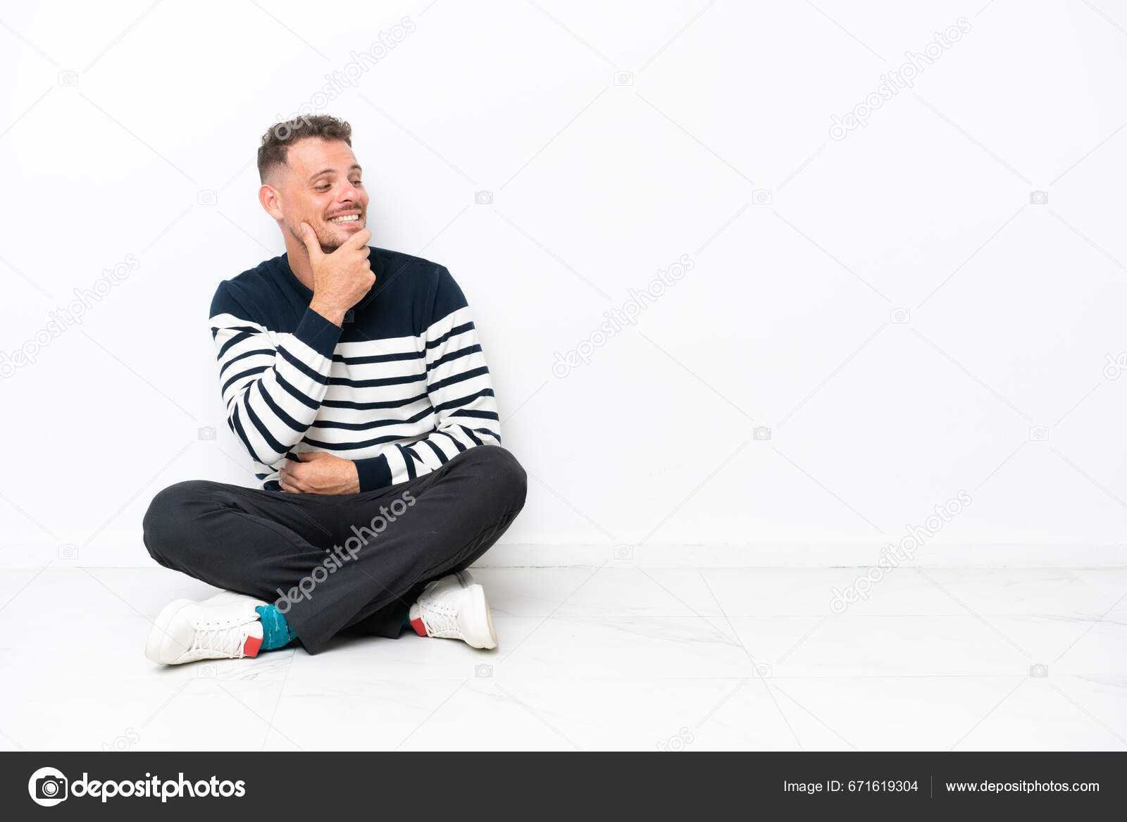 Young Man Sitting Floor Isolated White Background Looking Side — Stock ...