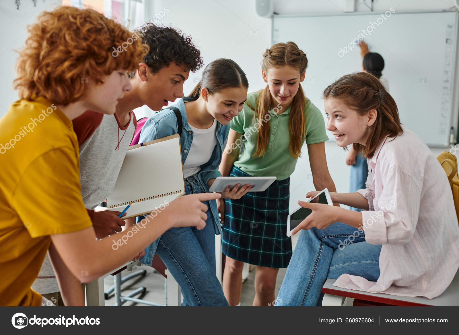 Smiling Teen Pupils Using Digital Tablet Together Classroom Blurred ...