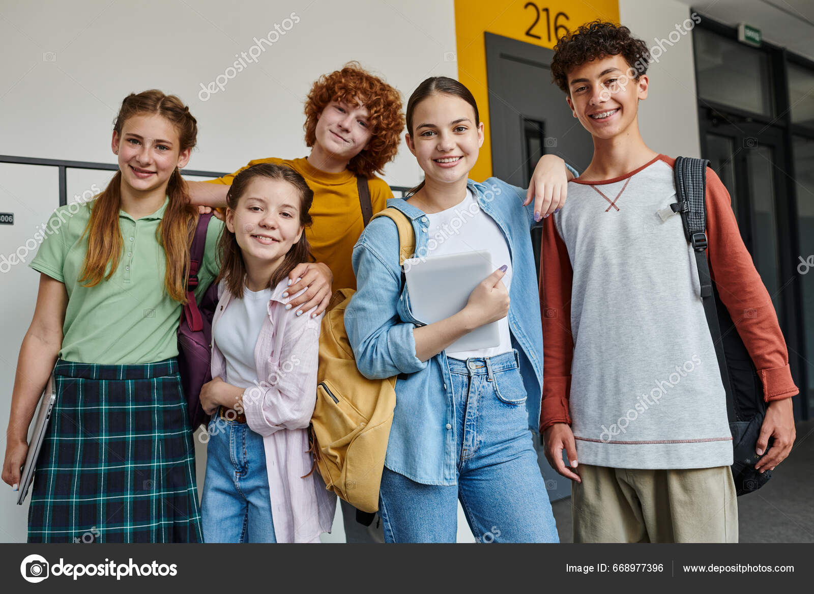 Back School Happy Teenagers Looking Camera Hallway Holding Devices ...