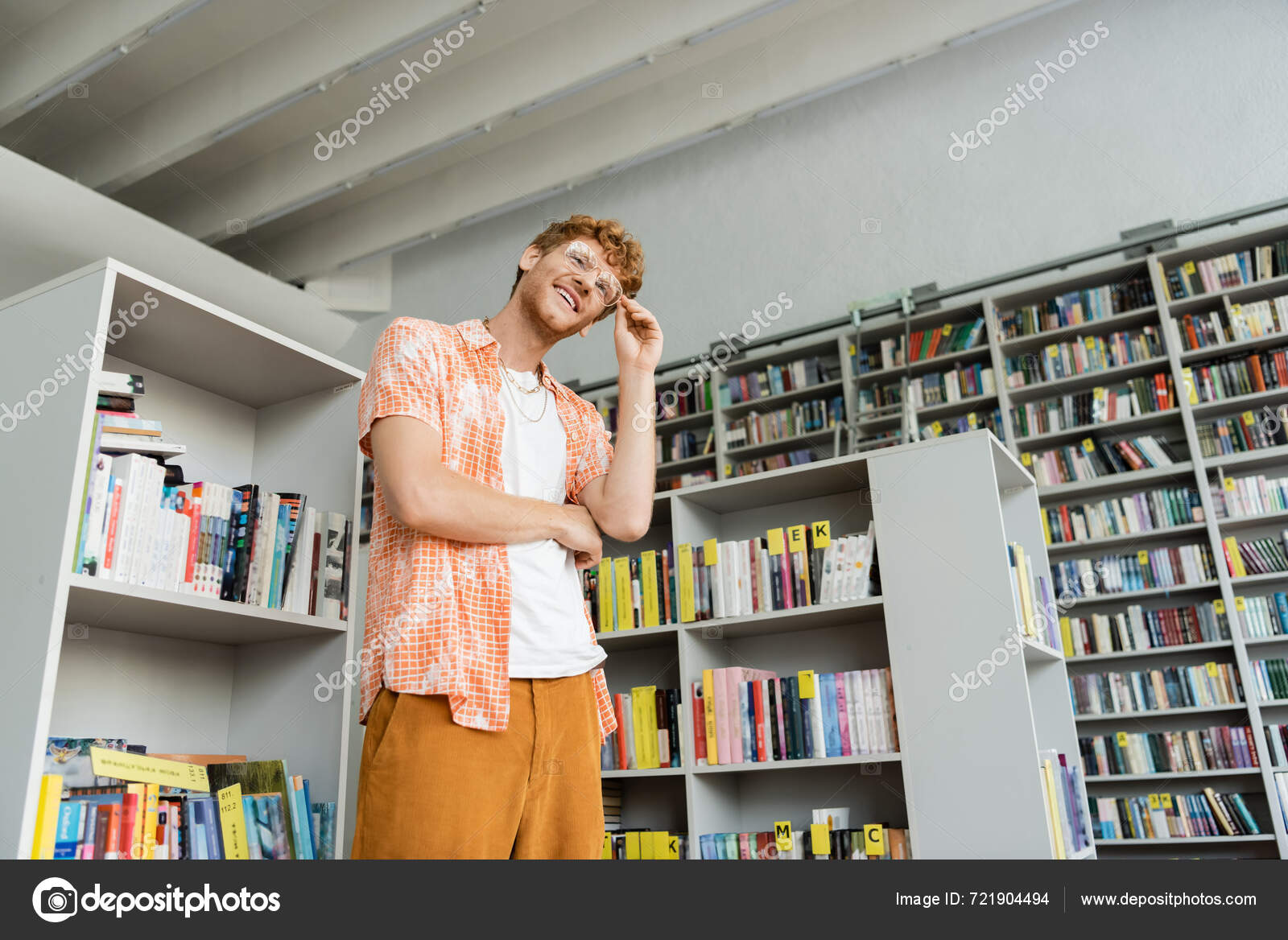 Young Man Front Bookshelf — Stock Photo © HayDmitriy #721904494
