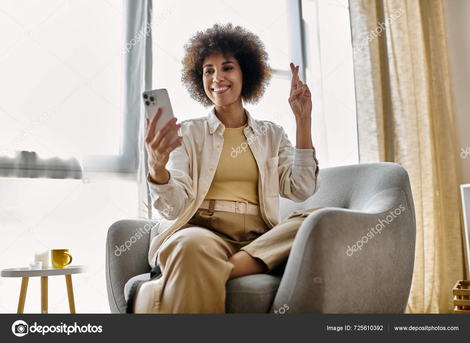 Woman Sits Chair Home Smiling Holding Smartphone — Stock Photo ... Woman Sits Chair Home Smiling Holding Smartphone — Stock Photo ...