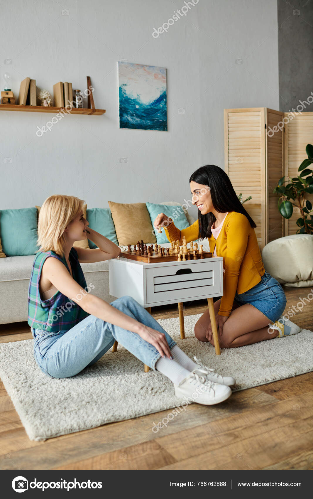 Two Young Women Play Chess Together Sharing Smiles Laughter Warm ...
