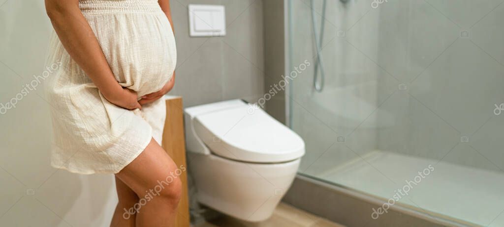 Incontinence and frequent urination during pregnancy. Pregnant woman need to pee standing by ...