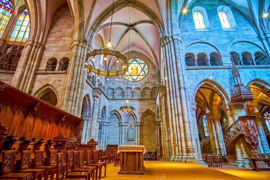 BASEL, SWITZERLAND - APRIL 1, 2022: The stone Altar and Choir chairs in ...