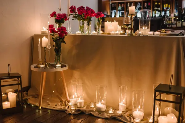 Table setting for couple, Valentine's Day evening, burning candles for ...