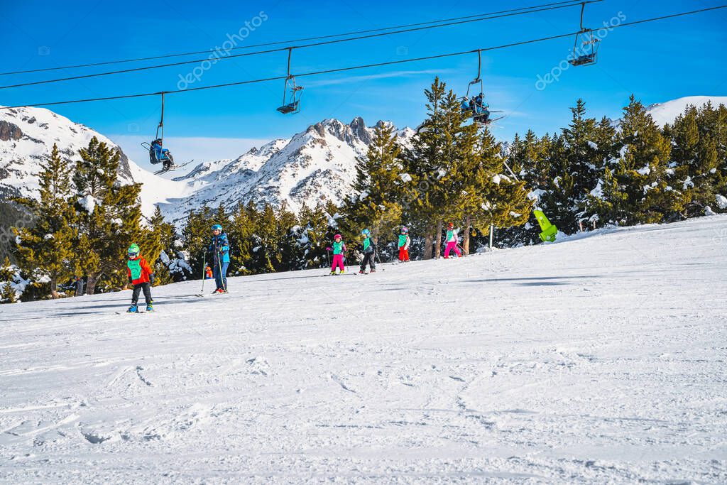 El Tarter, Andorra, Jan 2020 Ski trainer or instructor teaching a group ...