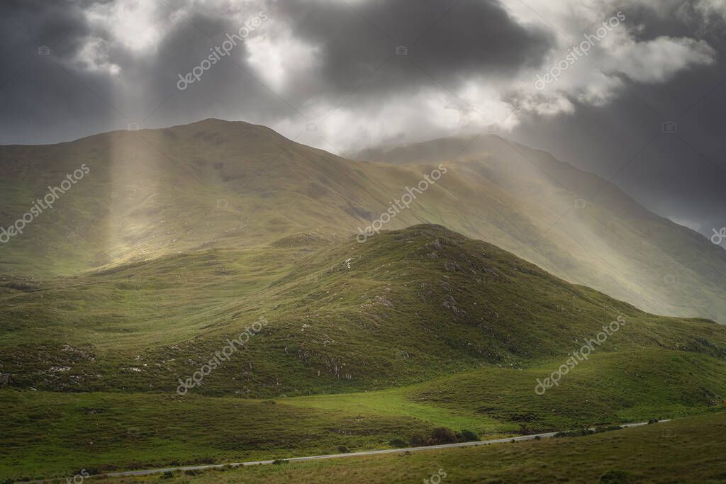 Doolough Valley, Glenummera and Glencullin mountain ranges illuminated ...