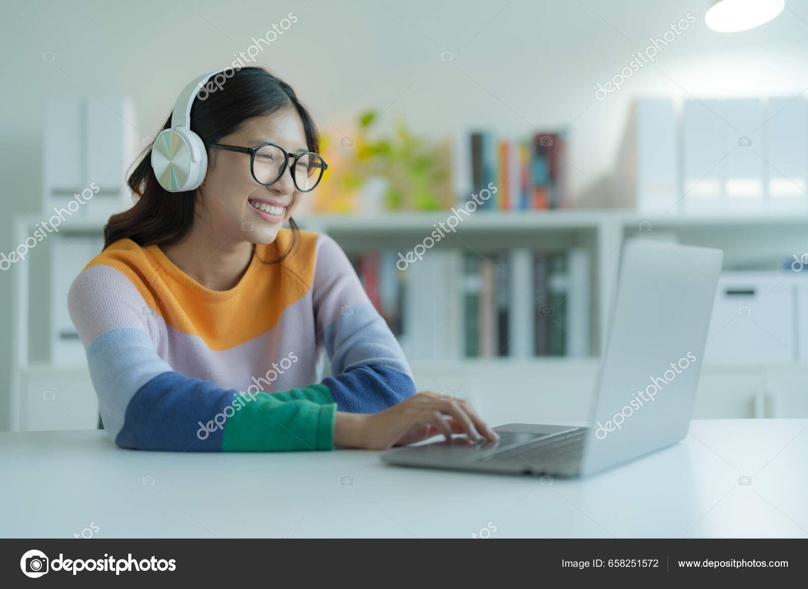 Young Woman Student Using Laptop Computer Library While Wearing Glasses ...