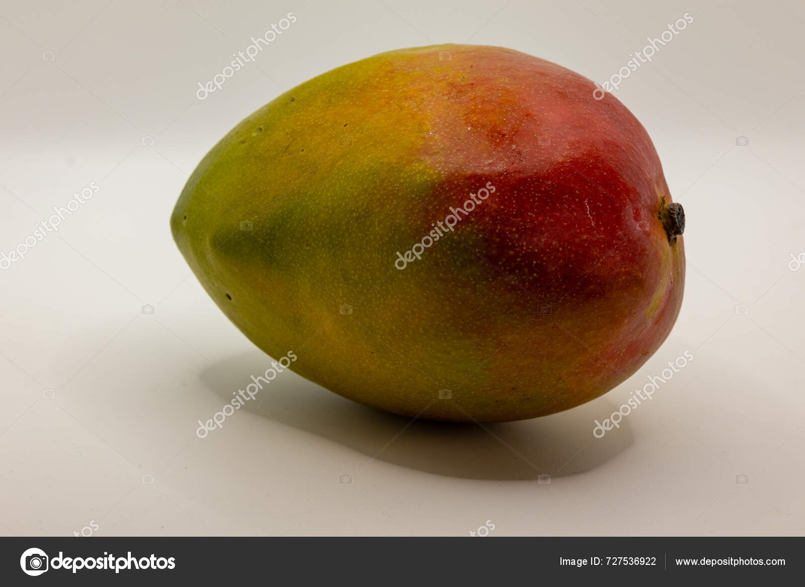 One Whole Ripe Mango — Stock Photo © kingsley.straker@gmail.com #727536922