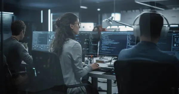 Team of Diverse Multiethnic Software Developers Working on Computers, Programming Advanced Code ...