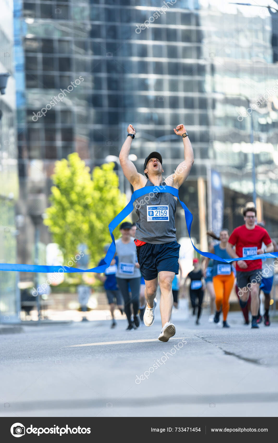 Portrait Athletic Male Jogger Crossing Finish Line Marathon Audience ...