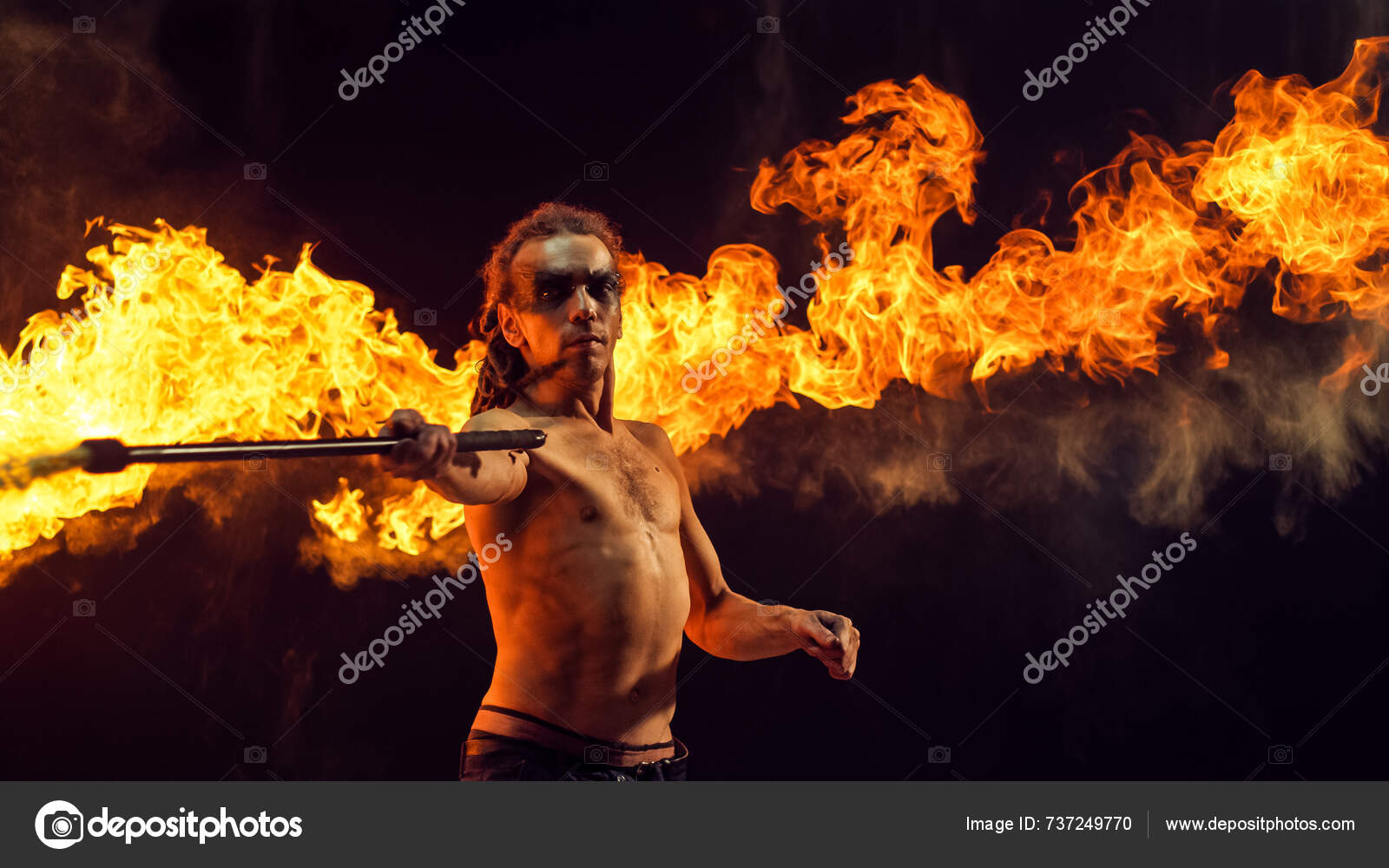Shirtless Male Fire Performer Dreadlocks Wields Flaming Staff Creating ...