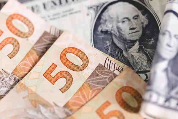 Brazilian Real note of 50 Reais with a dollar note from the United ...