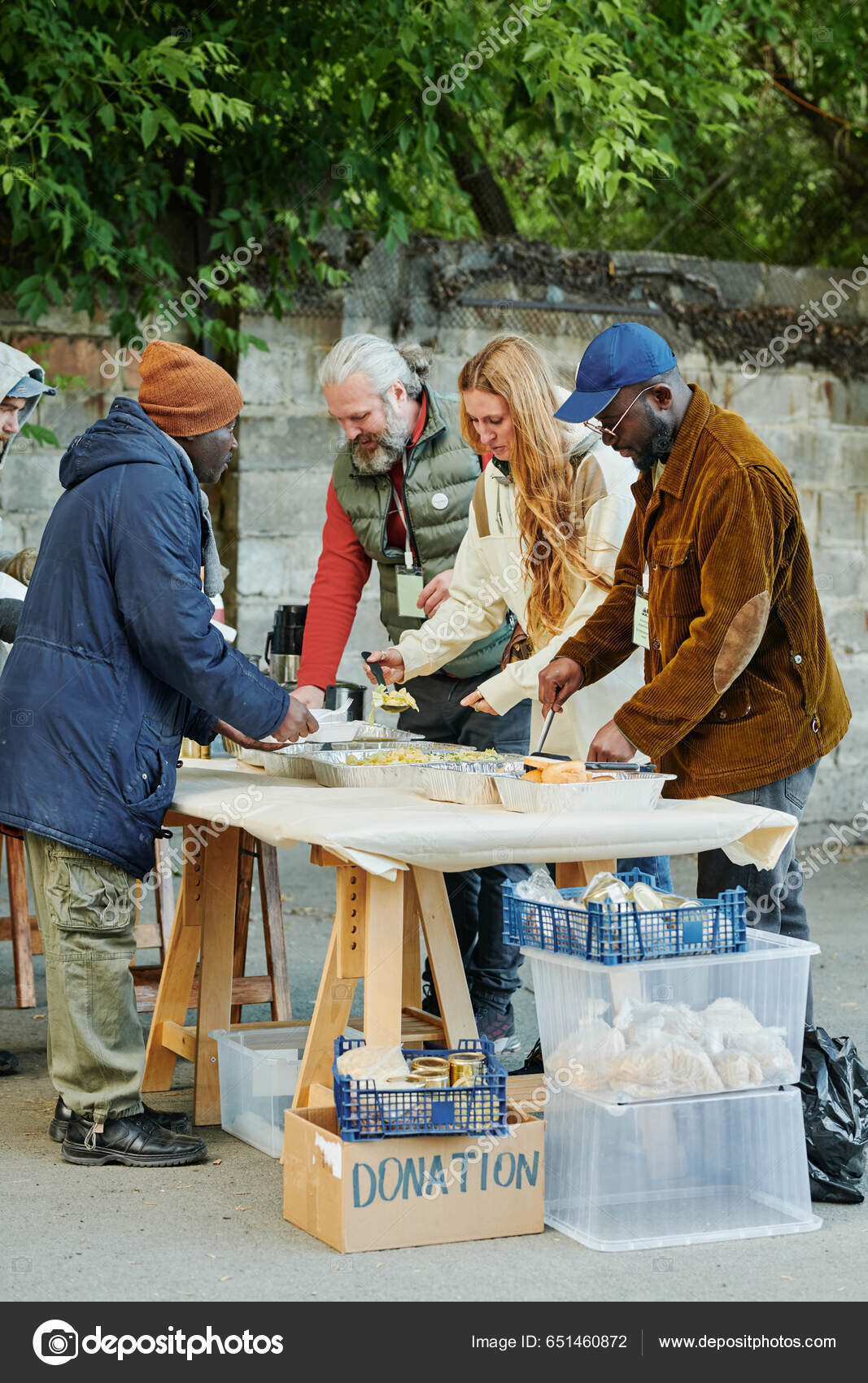 Person Giving Homeless Person Food