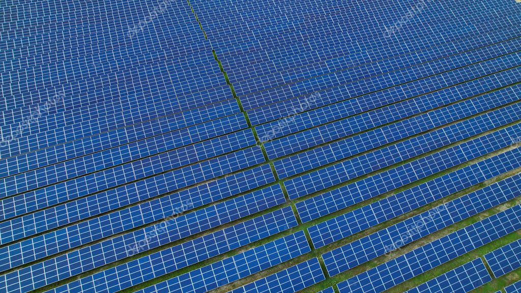 AERIAL: Huge array of lined up solar panels as a part of photovoltaic ...