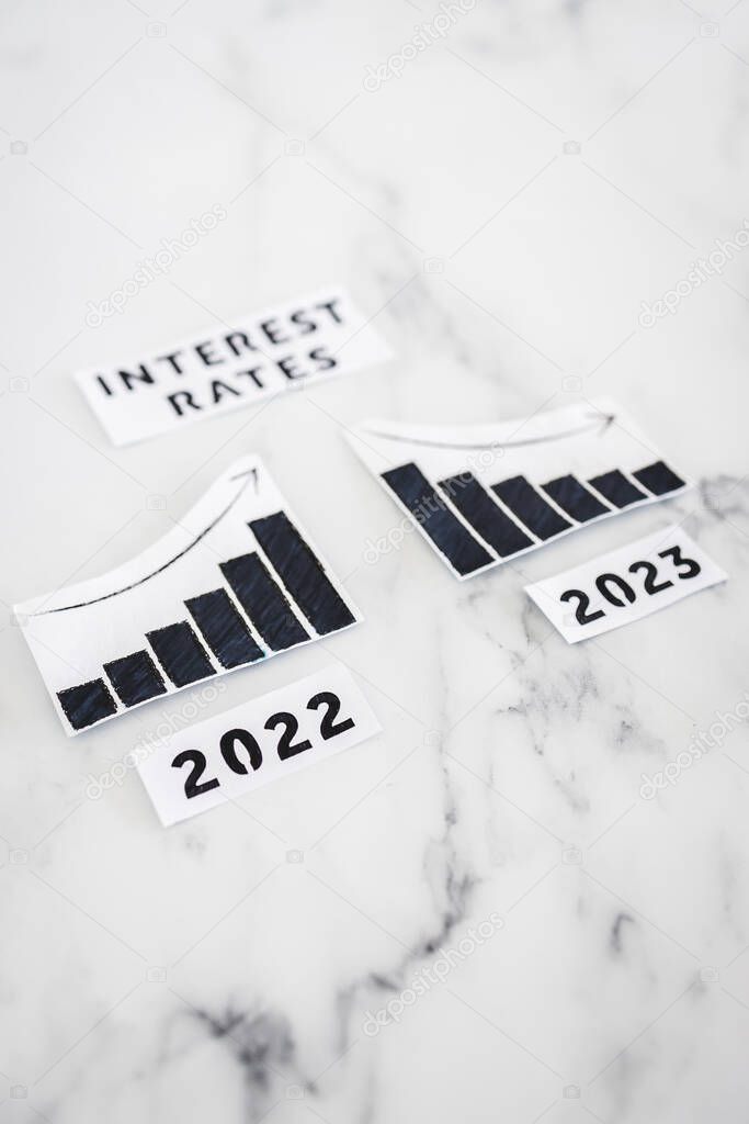 interest rates text with 2022 chart showing stats increasing and 2023 ...