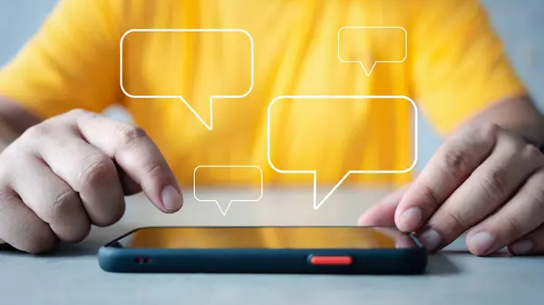 Men using smartphones to type text chat on a cell phone and chat box ...