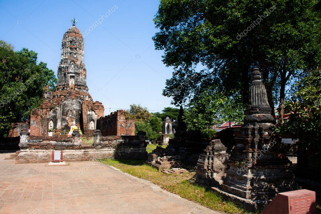 Ancient antique buddha statue and ruins old chedi stupa for thai people ...