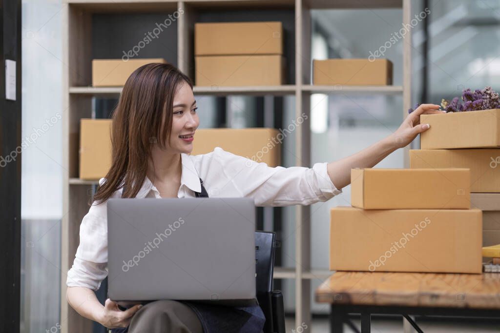 A portrait of a small startup, an SME owner, an Asian female ...