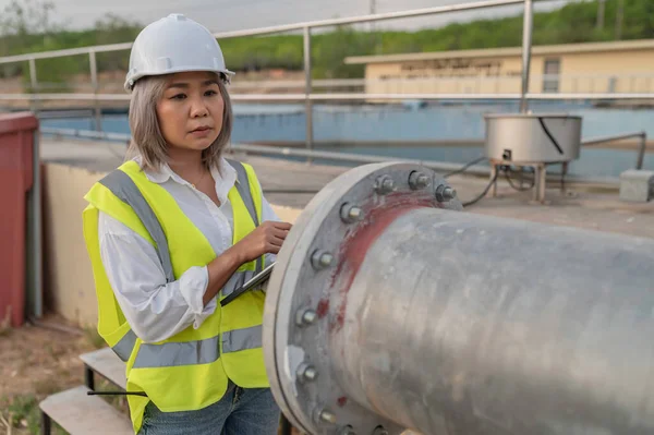 Environmental engineers work at wastewater treatment plants,Water ...